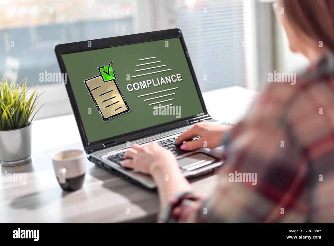 Laptop screen displaying a compliance concept Stock Photo - Alamy