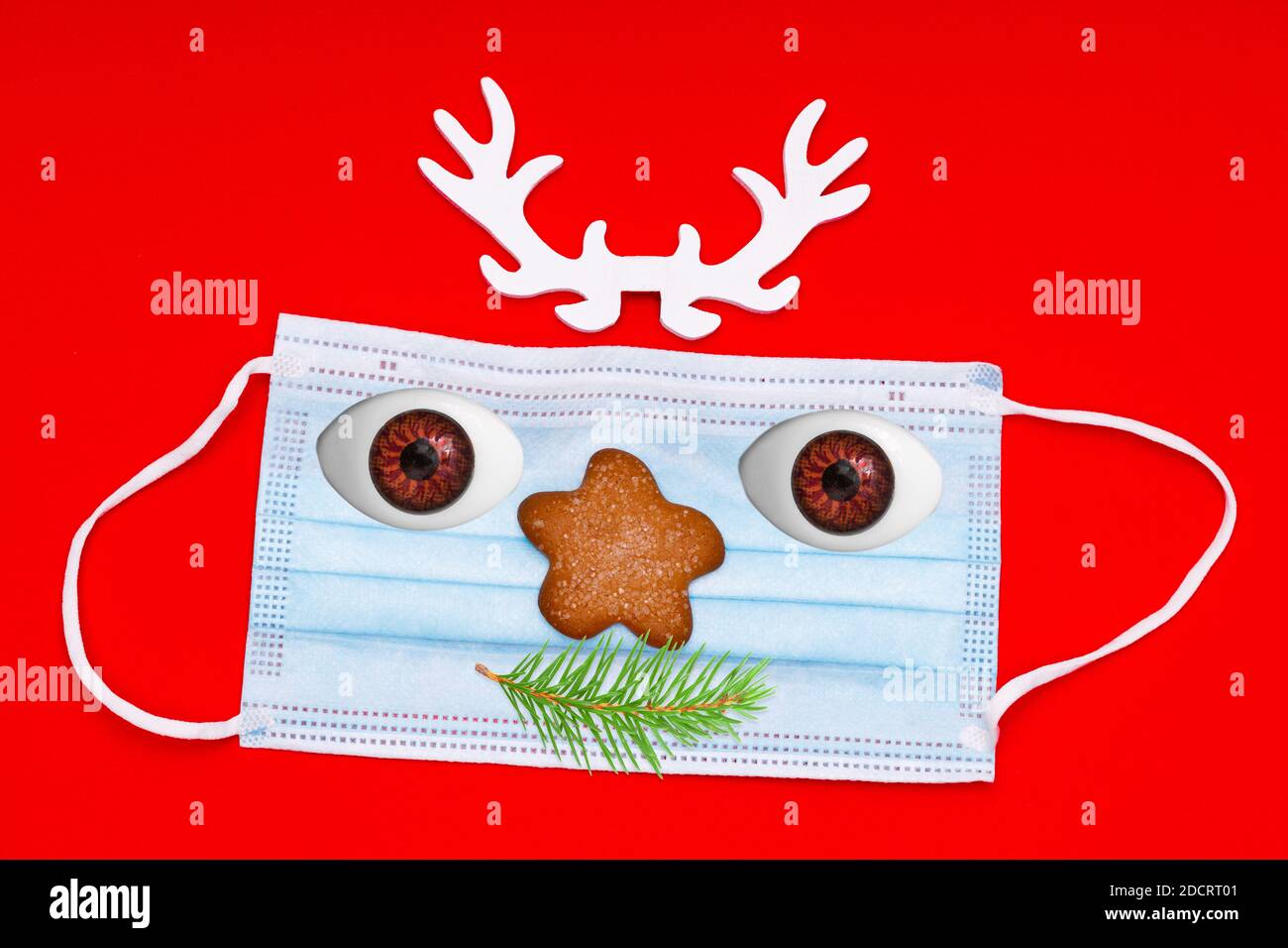 medical mask with deer antlers on a red background. High quality photo ...