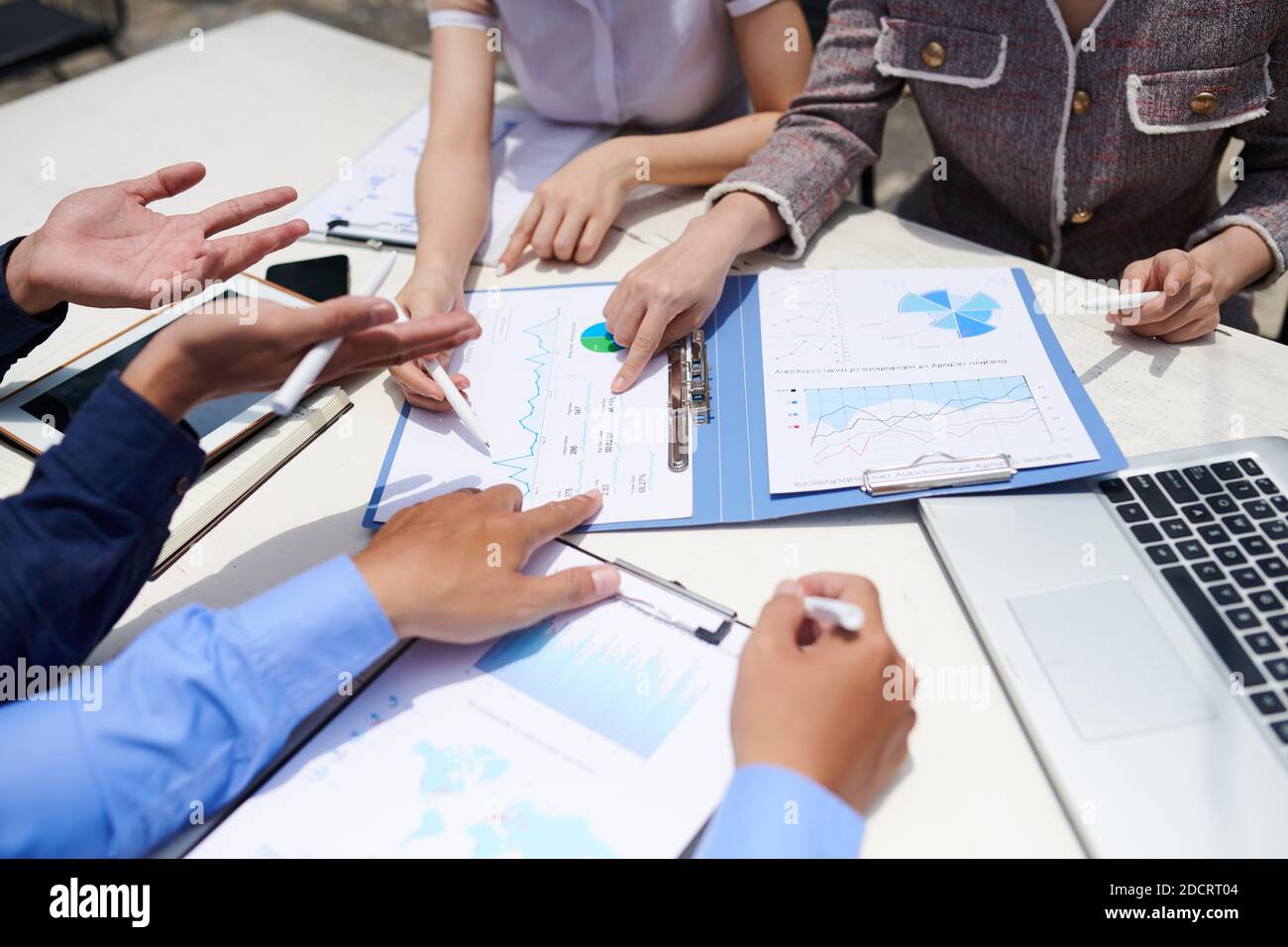 Business people discussing documents Stock Photo - Alamy