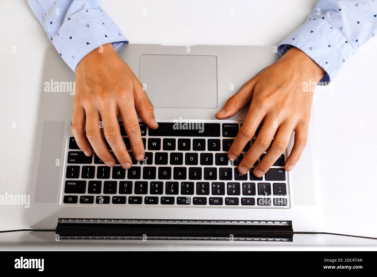 Student hands typing on a laptop keyboard, doing homework, studying at ...