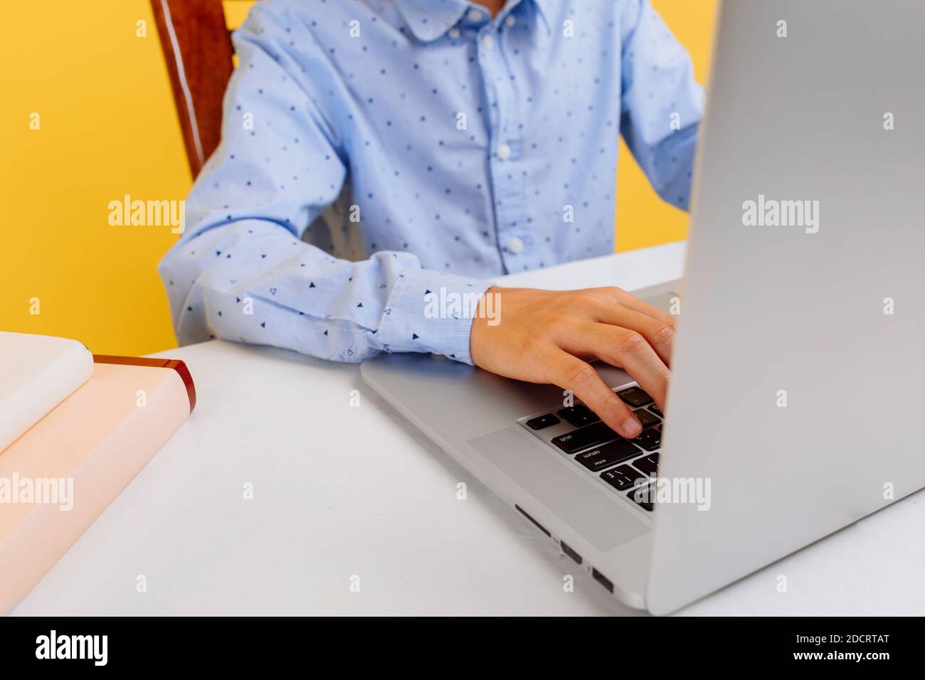 Student hands typing on a laptop keyboard, doing homework, studying at ...