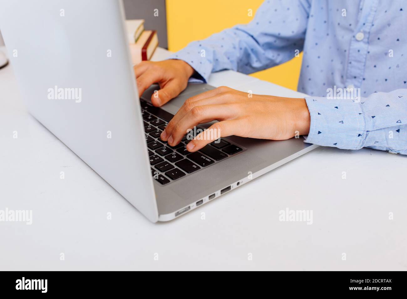Student hands typing on a laptop keyboard, doing homework, studying at ...