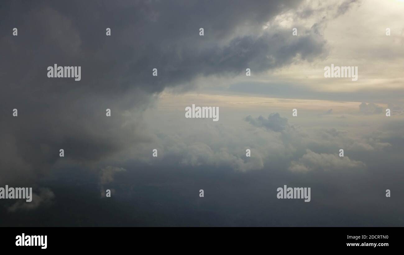 Rays of light shining through dark clouds for background Stock Photo ...