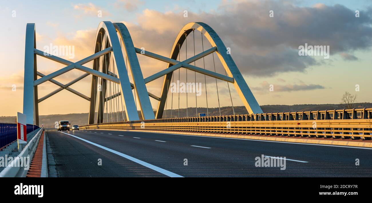 Modern construction highway bridge at sunset Stock Photo - Alamy