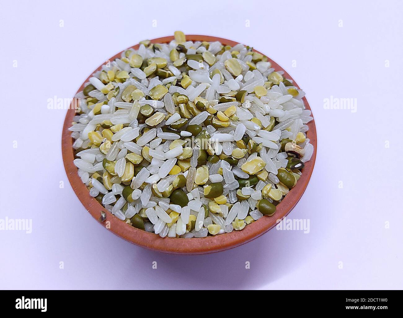 Different grains in the bowl, rice, moong beans, dal, mung dal, lentils ...