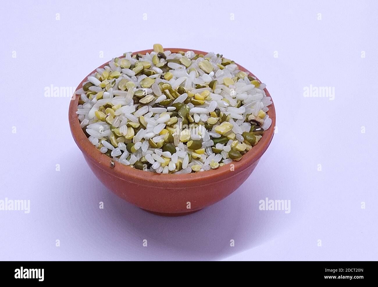 Different grains in the bowl, rice, moong beans, dal, mung dal, lentils ...