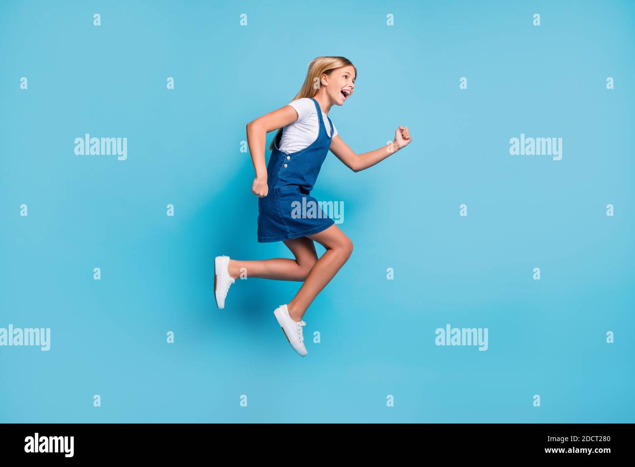 Profile full size photo of cheerful funny blond girl jumping yell wear ...