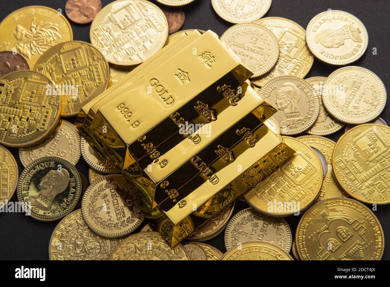 A closeup shot of a pile of shiny gold coins and bars Stock Photo - Alamy