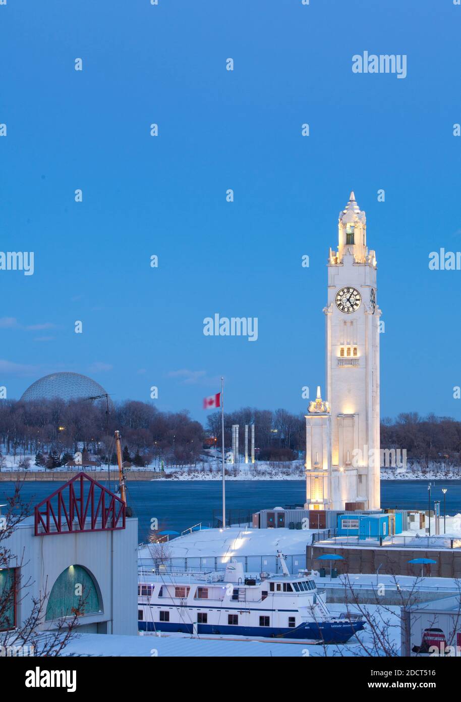 MONTREAL'S OLD PORT (VIEUX PORT) CLOCK TOWER AT DUSK, BESIDE THE SAINT ...