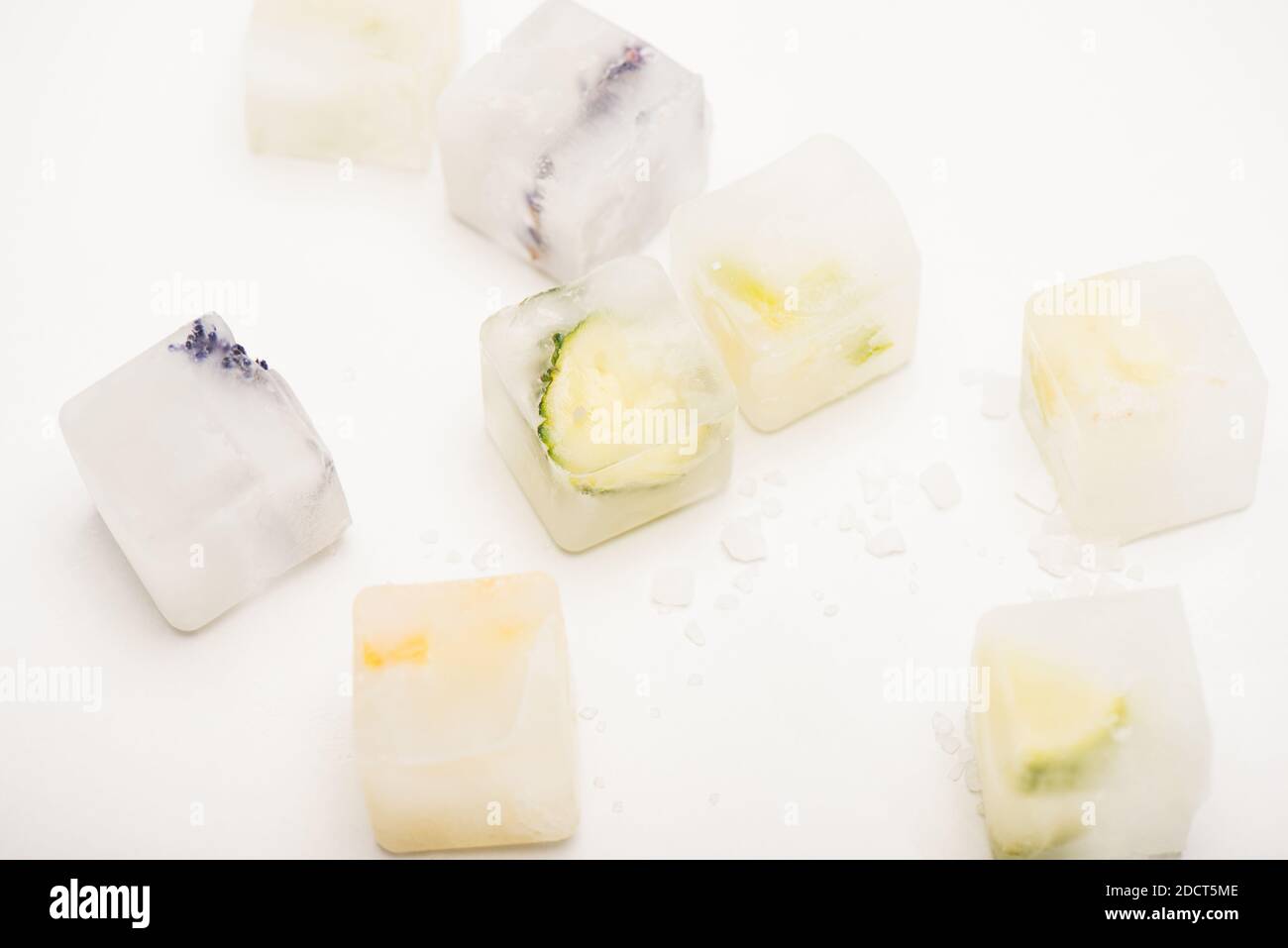 floral, fruit and vegetable refreshing ice cubes on white Stock Photo ...