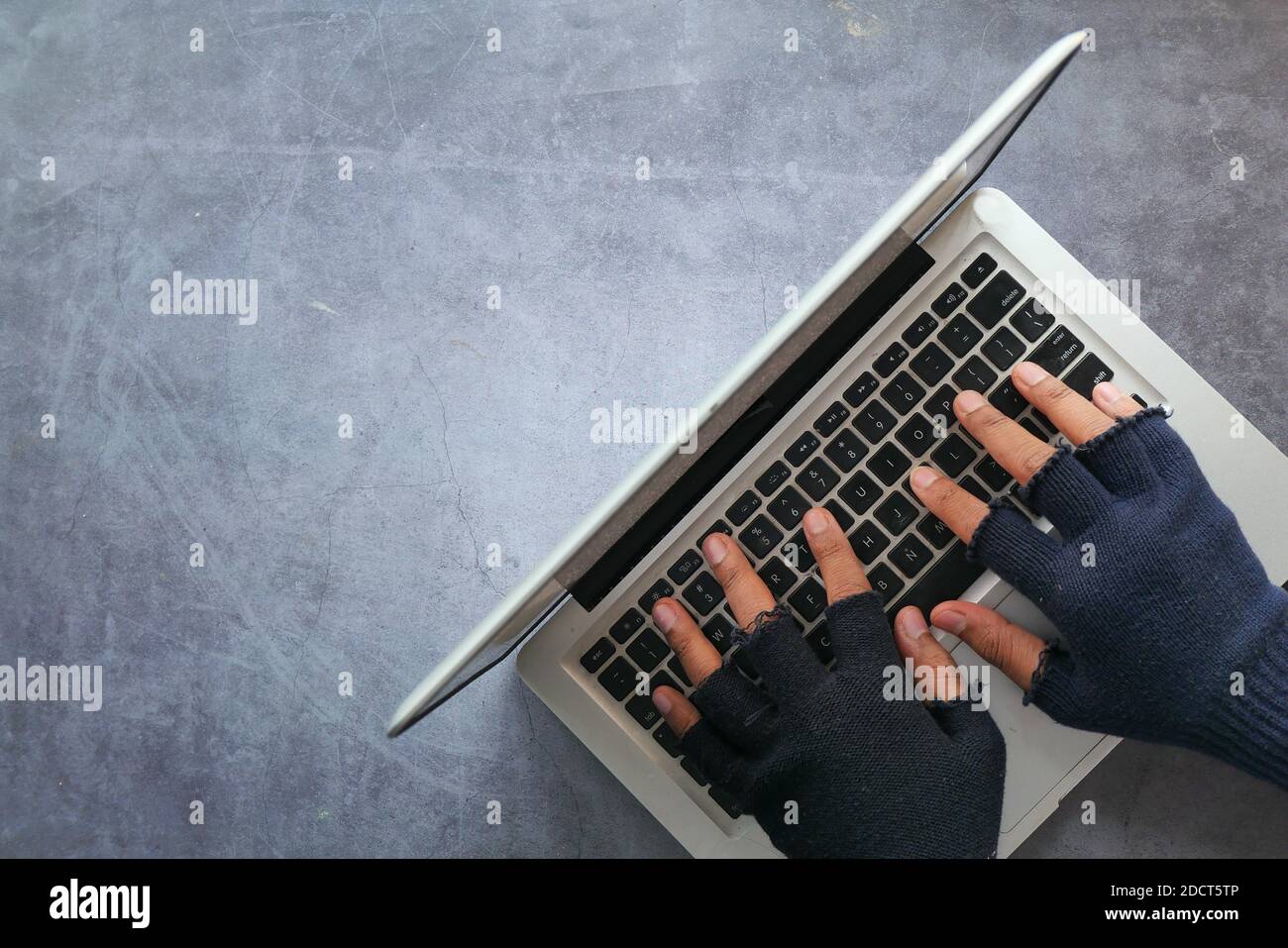 hacker hand stealing data from laptop top down Stock Photo - Alamy
