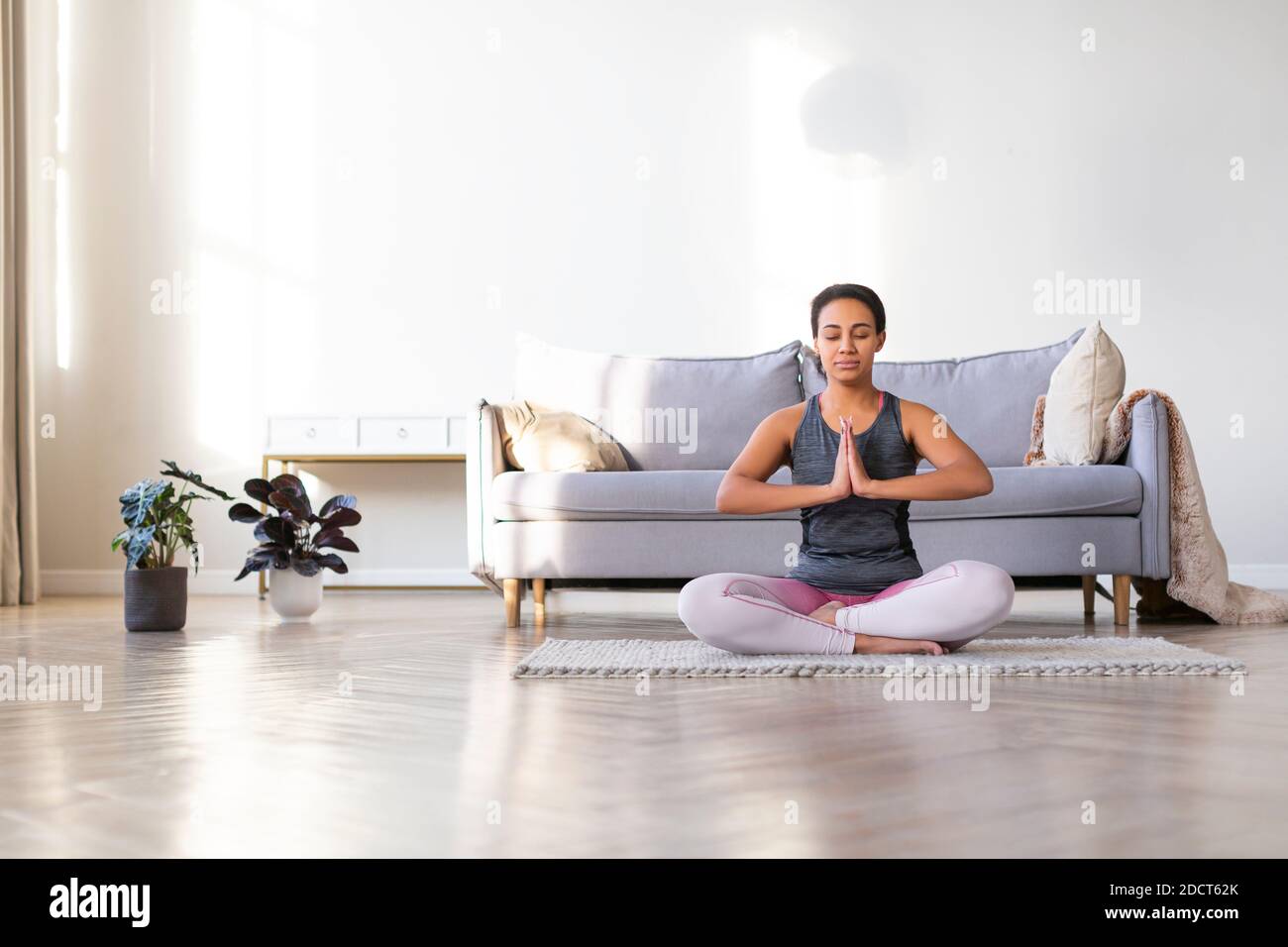 African american woman doing yoga hi-res stock photography and images ...