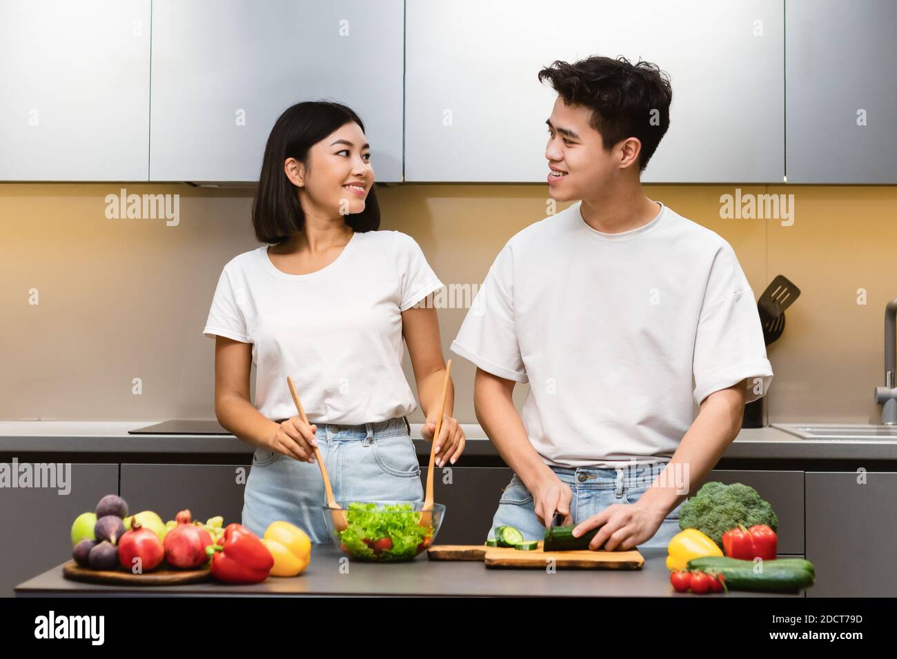 Asian female cooking dinner hi-res stock photography and images - Alamy