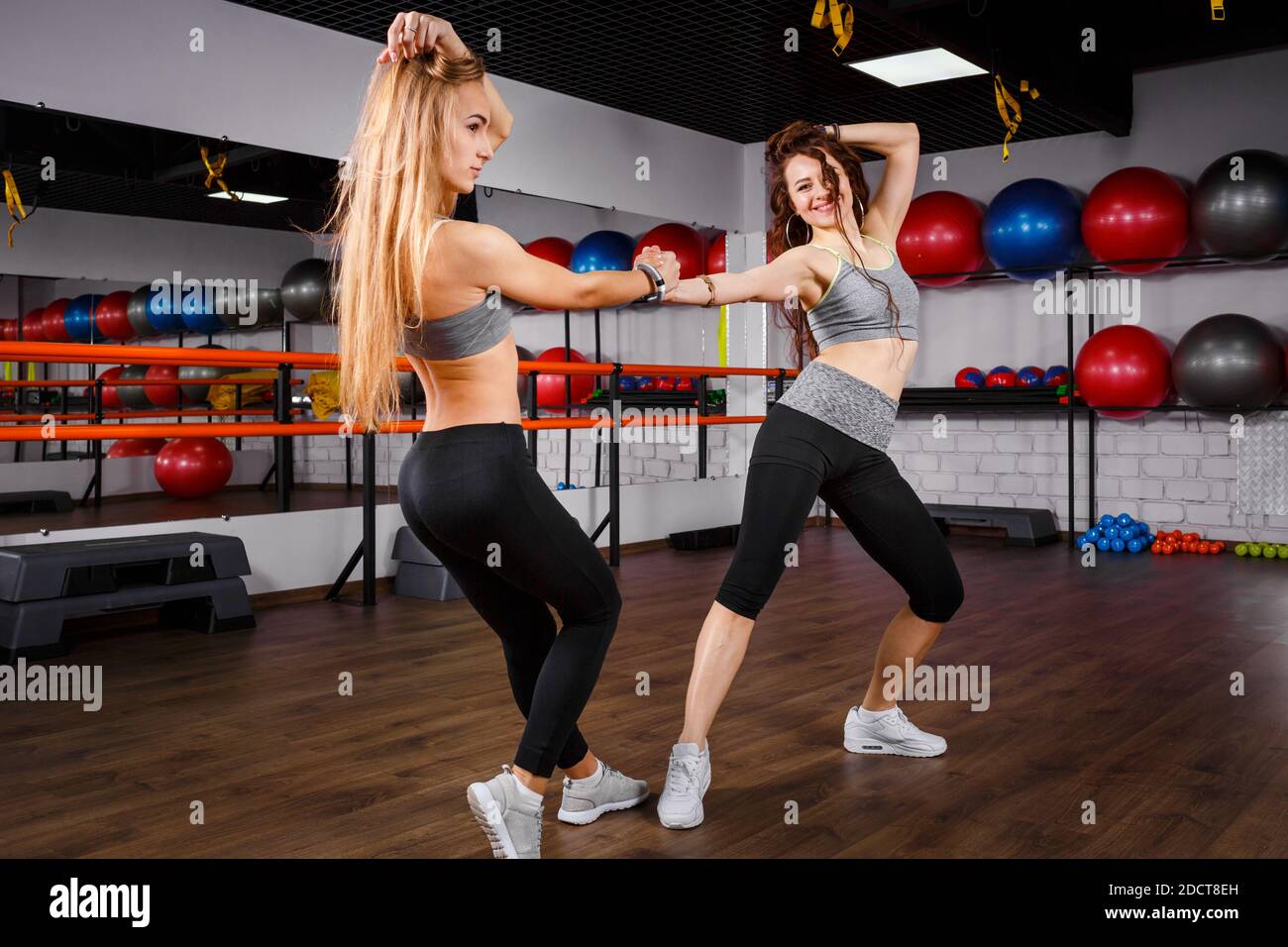 Young woman practicing dancing exercises in studio Stock Photo - Alamy