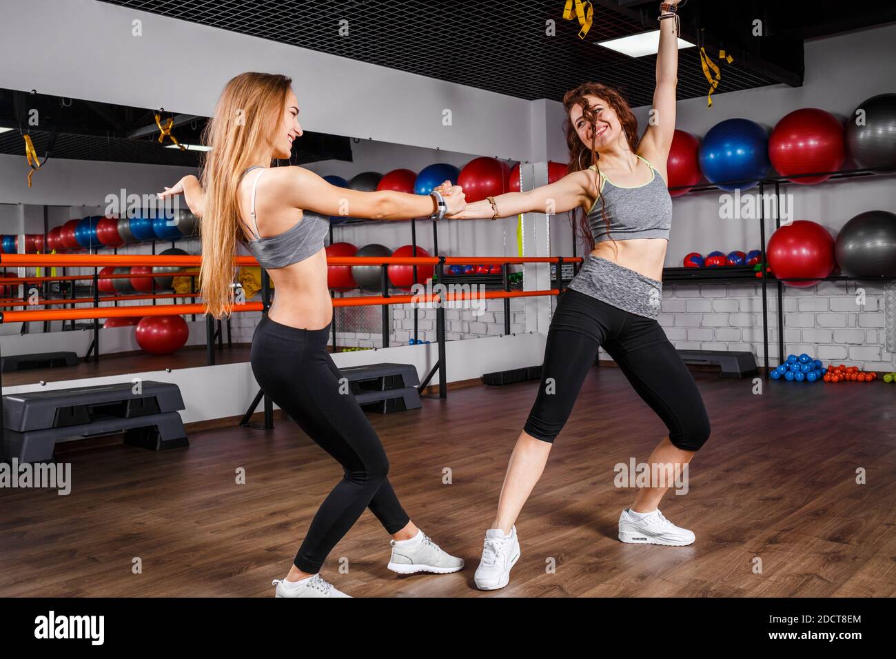 Young woman practicing dancing exercises in studio Stock Photo - Alamy