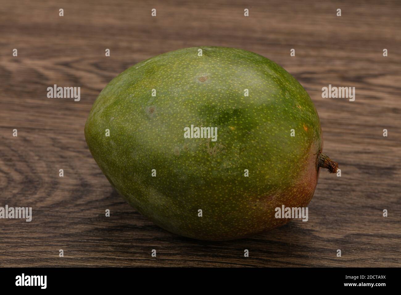 Tropical fruit - Green sweet tasty mango Stock Photo - Alamy