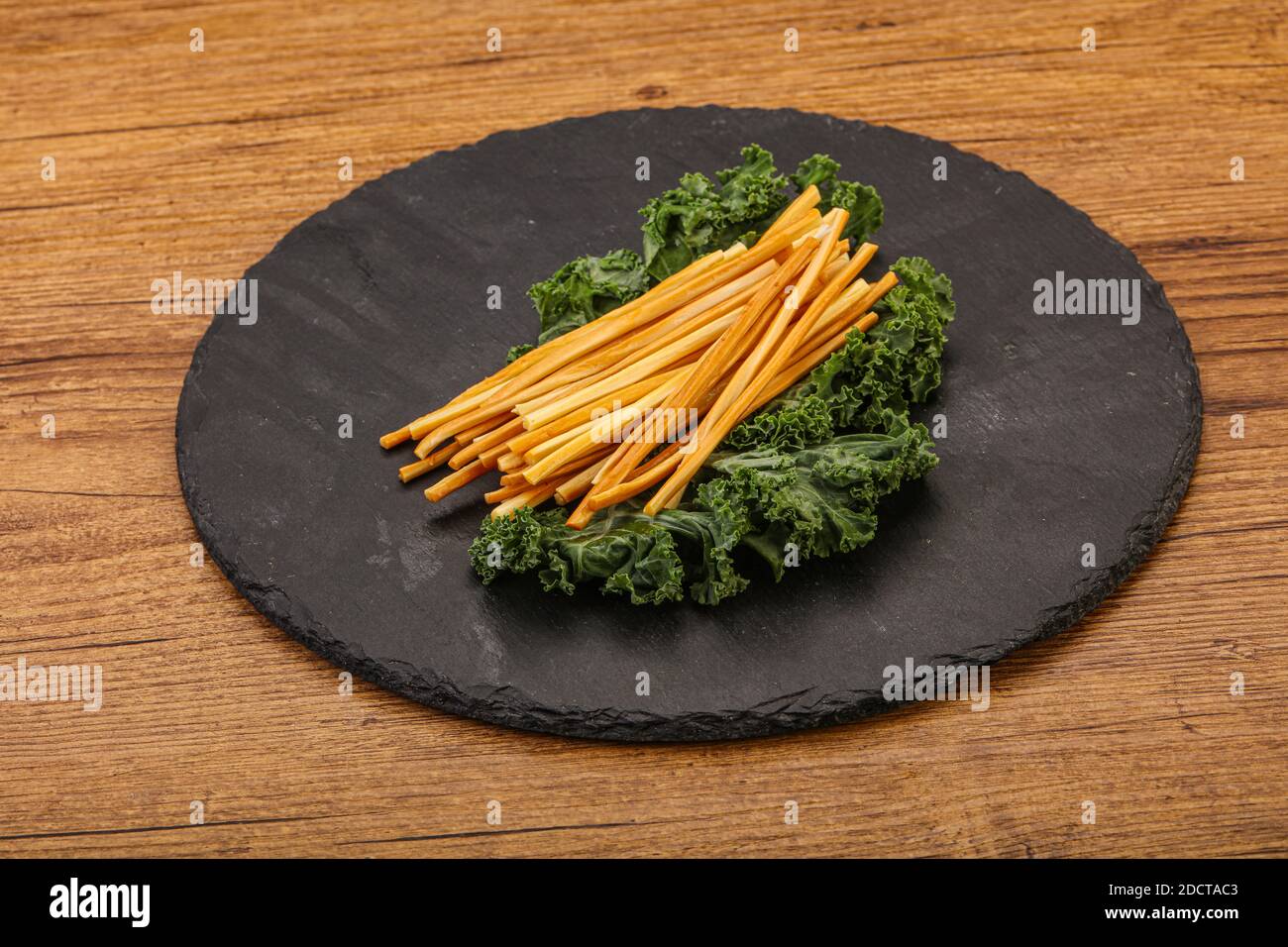 Caucasian Chechel cheese sticks over board Stock Photo - Alamy