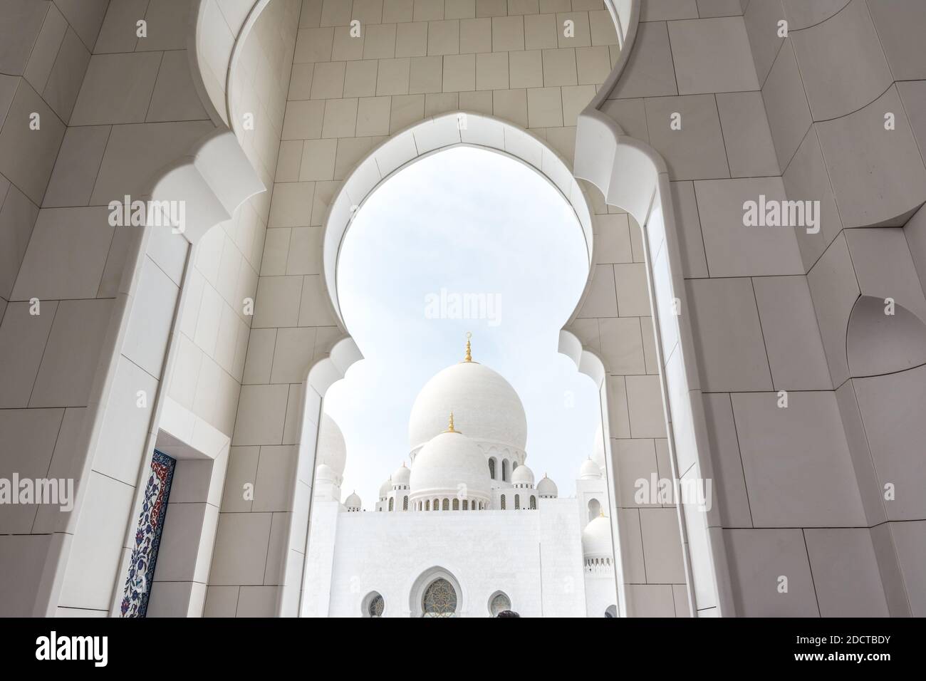 Gate and domes of White Grand Mosque built with white marble stone ...