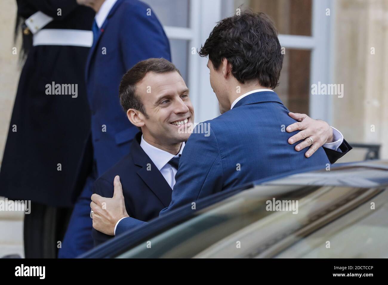 French President Emmanuel Macron greets Canada's President Justin ...