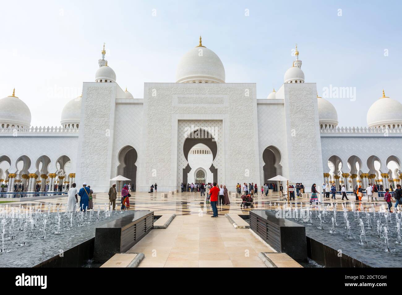 Lots of tourists visiting the Grand Mosque built with marble stone ...