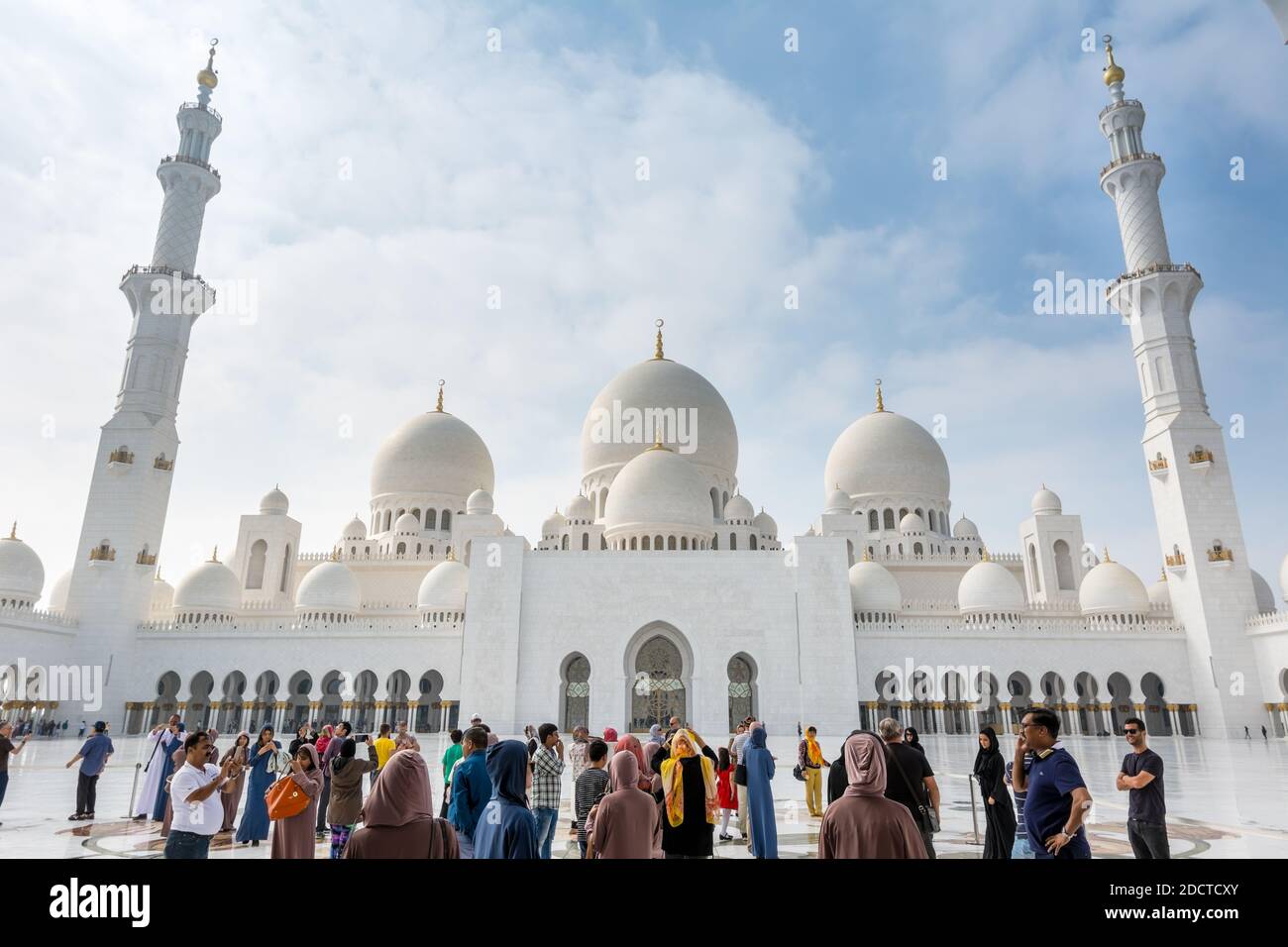Lots of tourists visiting the Grand Mosque built with marble stone ...