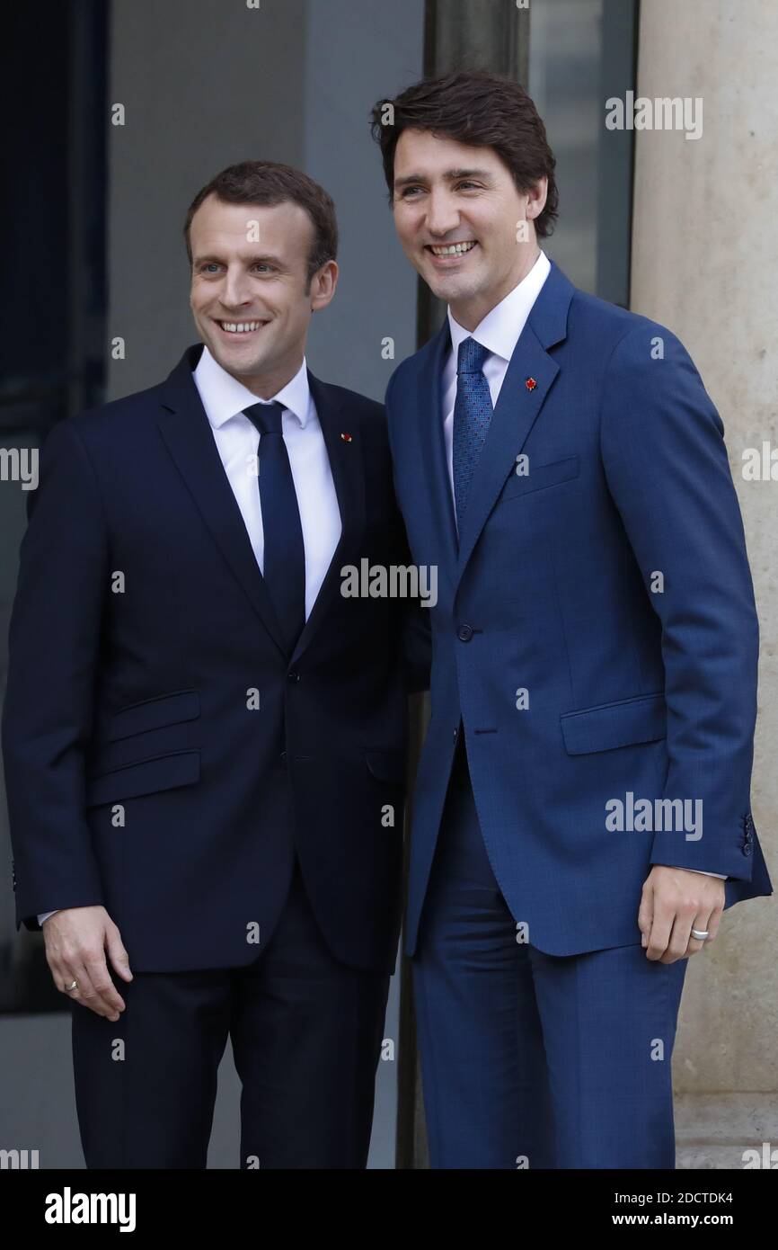 French President Emmanuel Macron greets Canada's President Justin ...