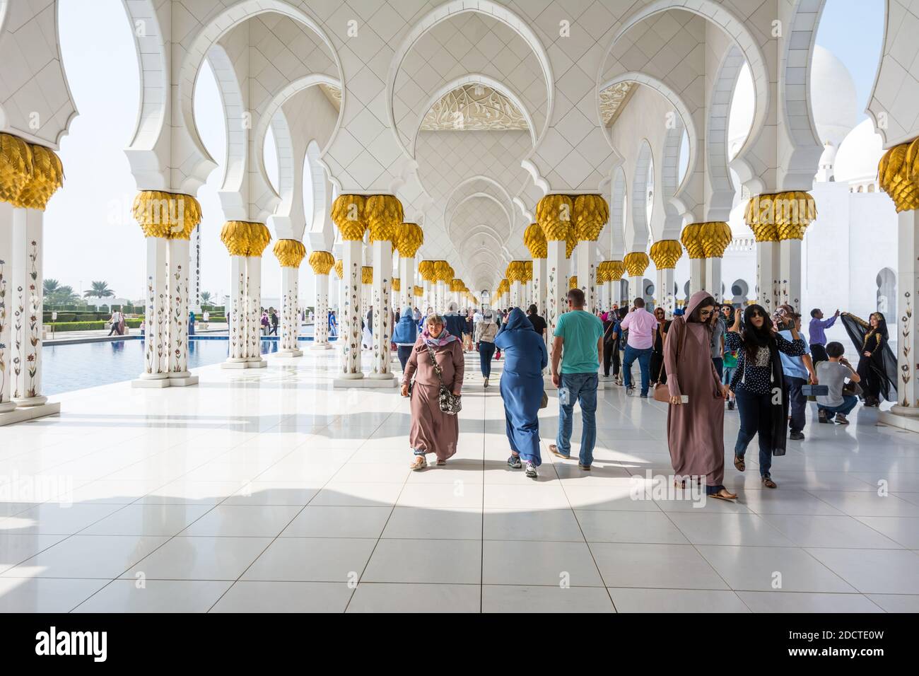 Lots of tourists visiting the Grand Mosque built with marble stone ...