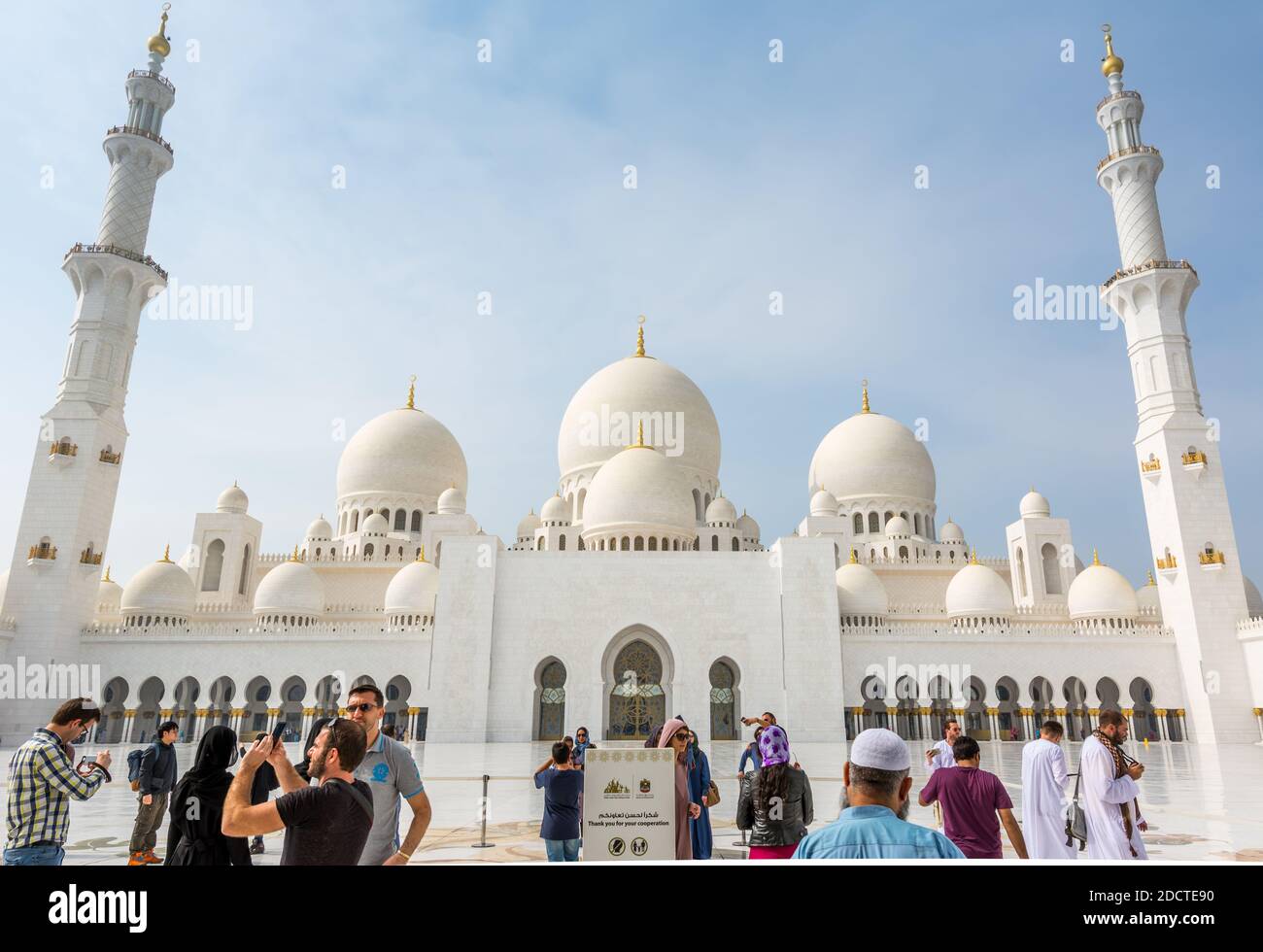 Lots of tourists visiting the Grand Mosque built with marble stone ...