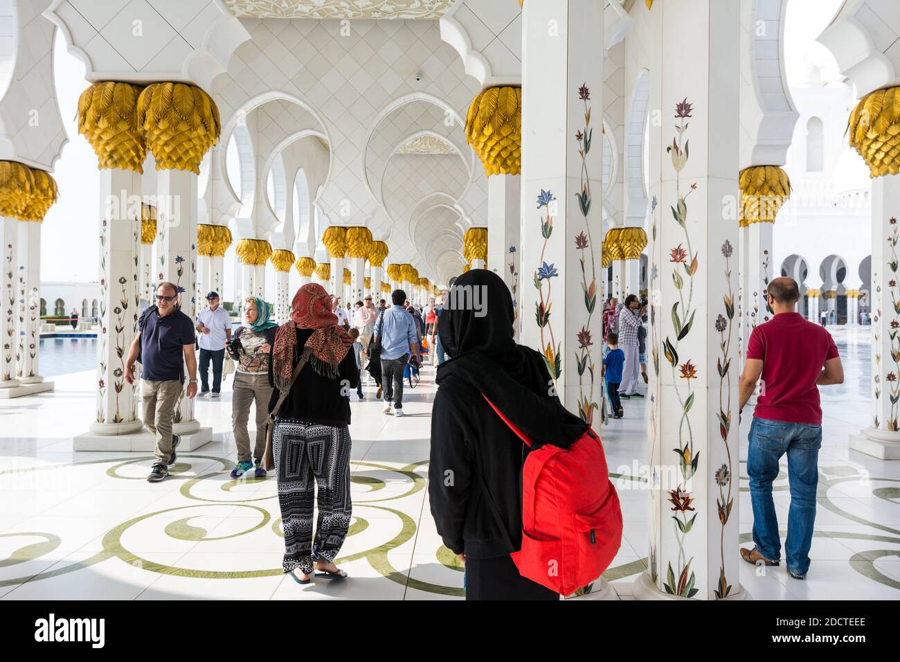 Lots of tourists visiting the Grand Mosque built with marble stone ...