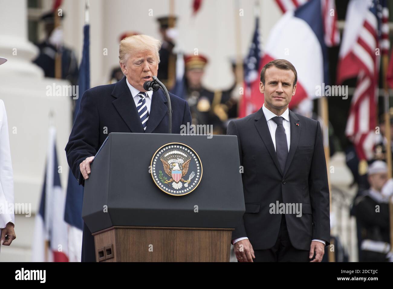 French President Emmanuel Macron listens to United States President ...