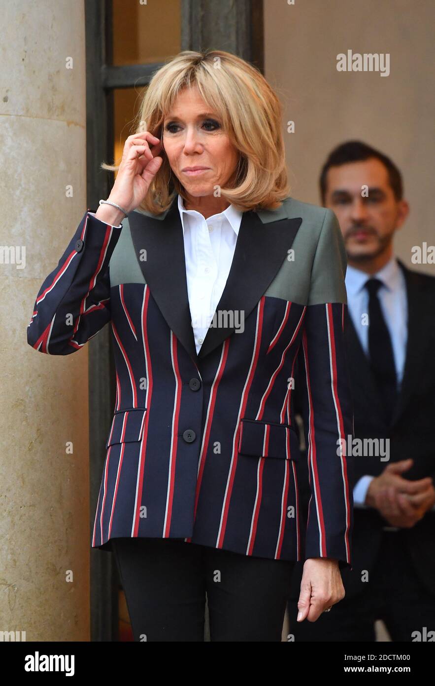 Ermine Erdogan is welcomed by Brigitte Macron during an official ...
