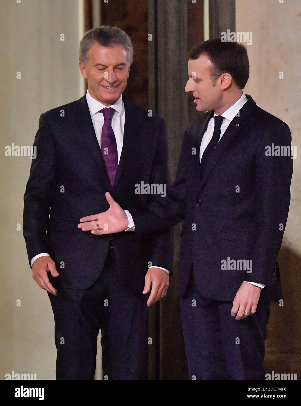 French president Emmanuel Macron greets his Argentinian counterpart ...