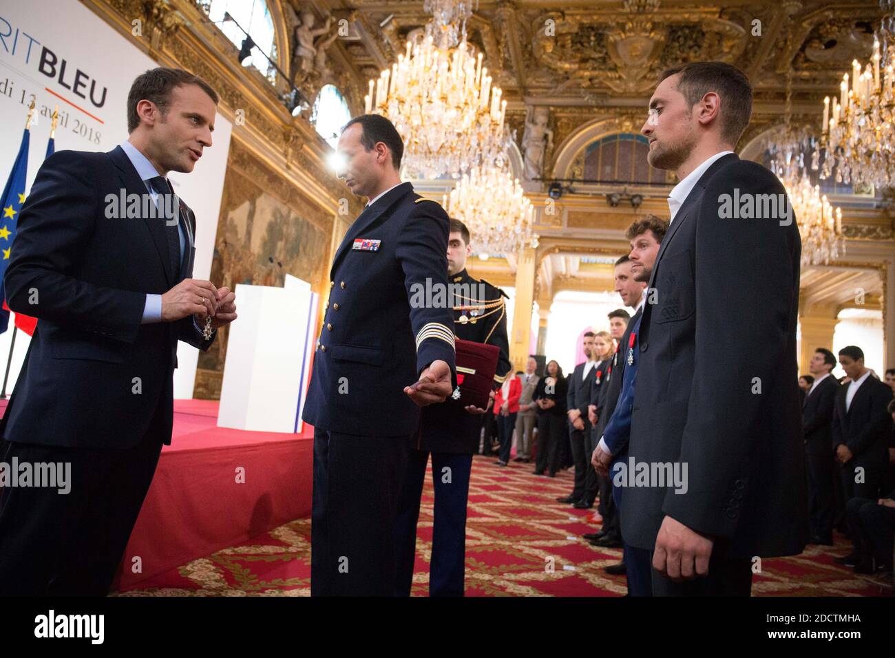 French President Emmanuel Macron receives during an award ceremony ...