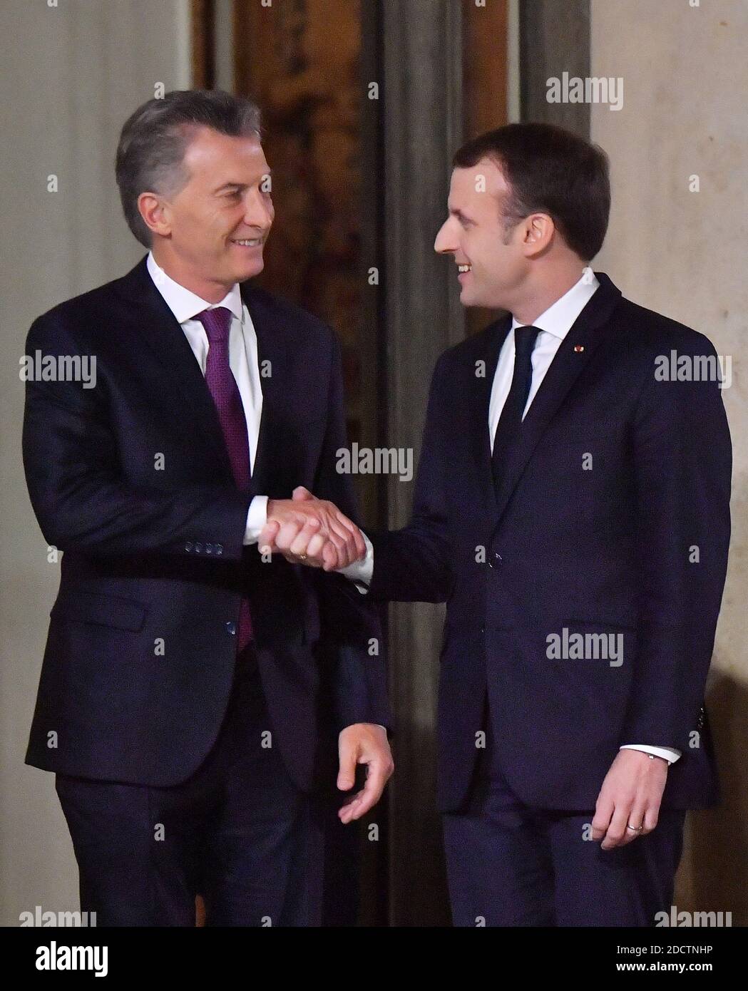 French president Emmanuel Macron greets his Argentinian counterpart ...