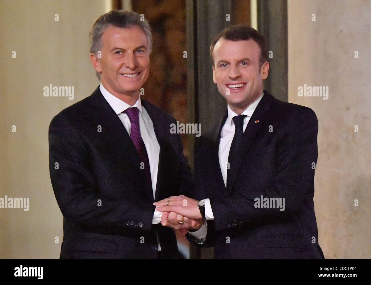 French president Emmanuel Macron greets his Argentinian counterpart ...