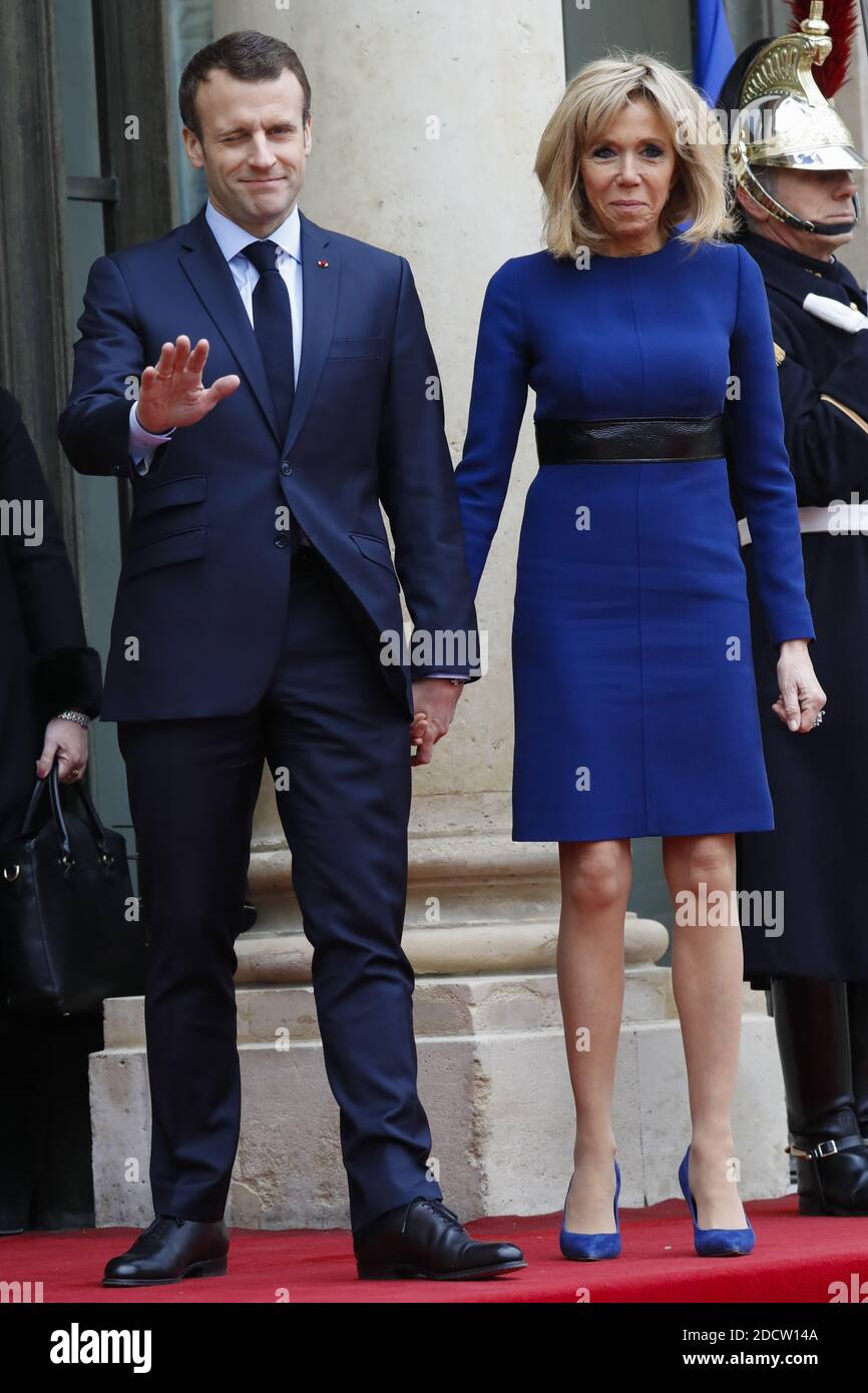 French President Emmanuel Macron and his wife Brigitte receiving the ...
