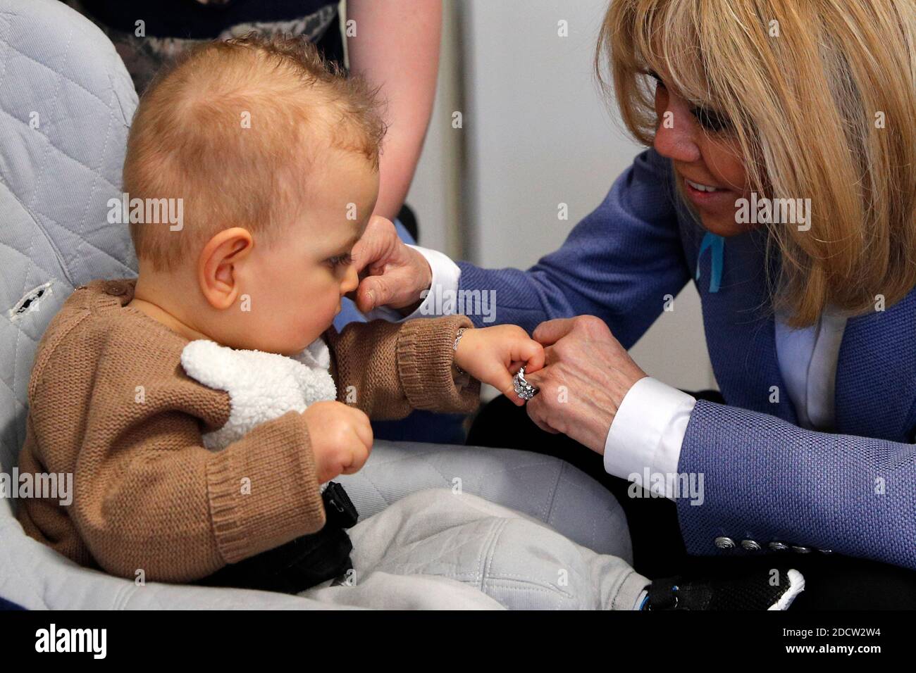 French President Emmanuel Macron's wife Brigitte Macron smiles to a ...