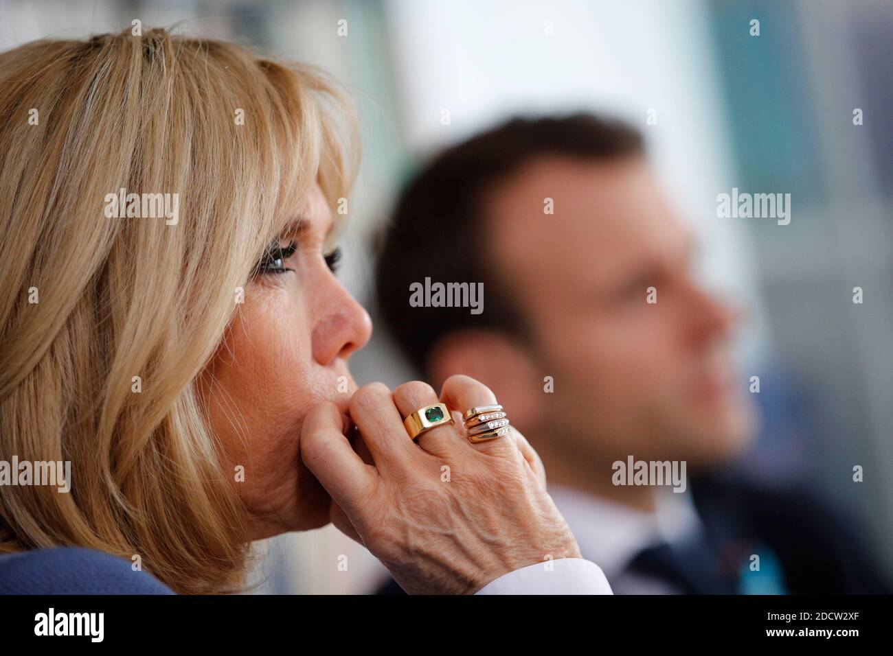 French President Emmanuel Macron's wife Brigitte Macron listens to ...