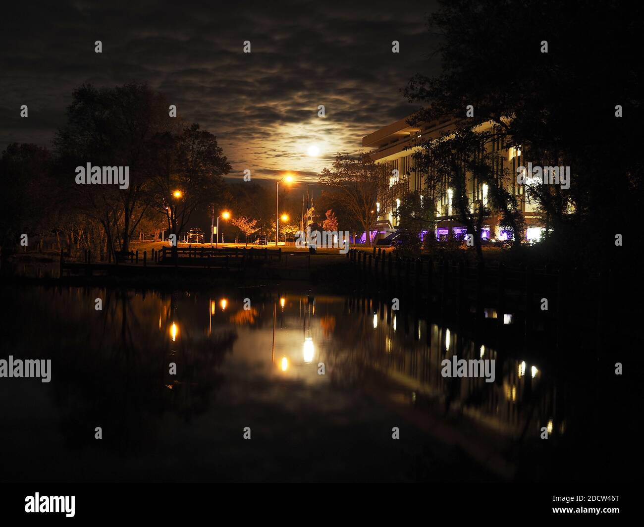 Night Landscape of full moon with building and sky reflection off the ...