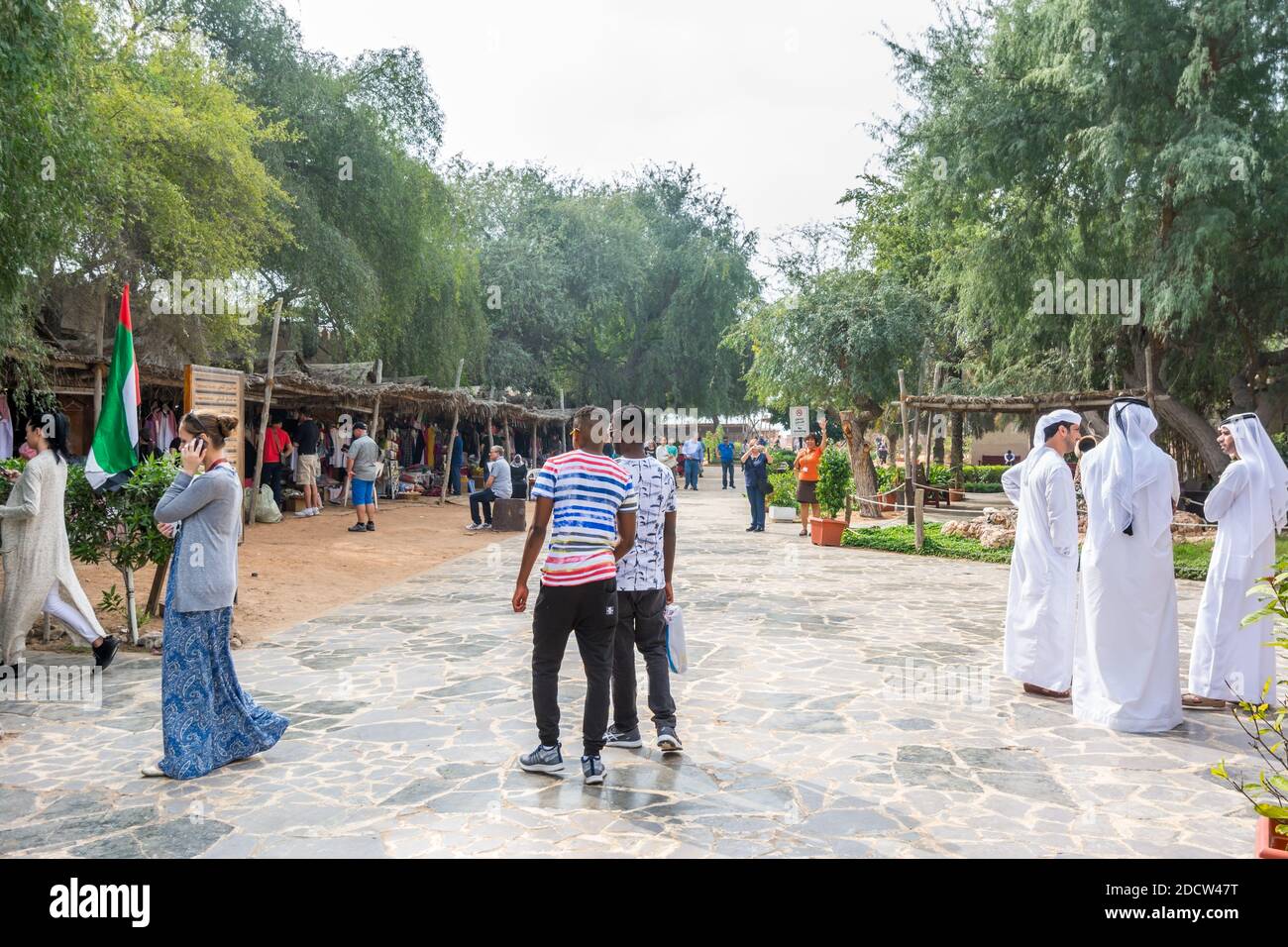 Tourists visiting the Heritage folk village in Abu Dhabi, United Arab ...