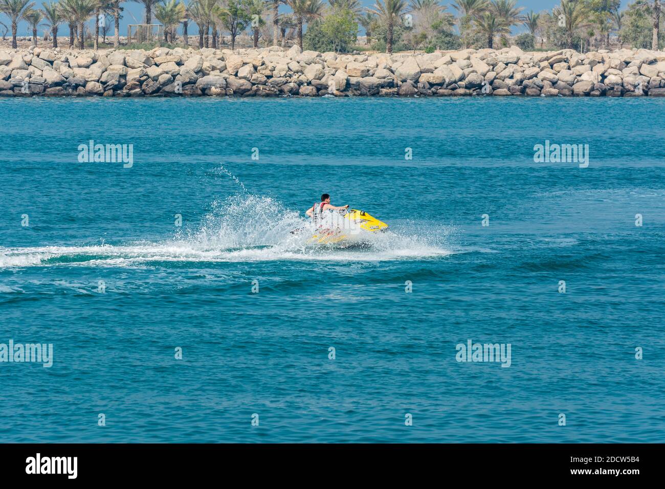 Tourist riding jet ski in the Persian bay in Abu Dhabi, United Arab ...