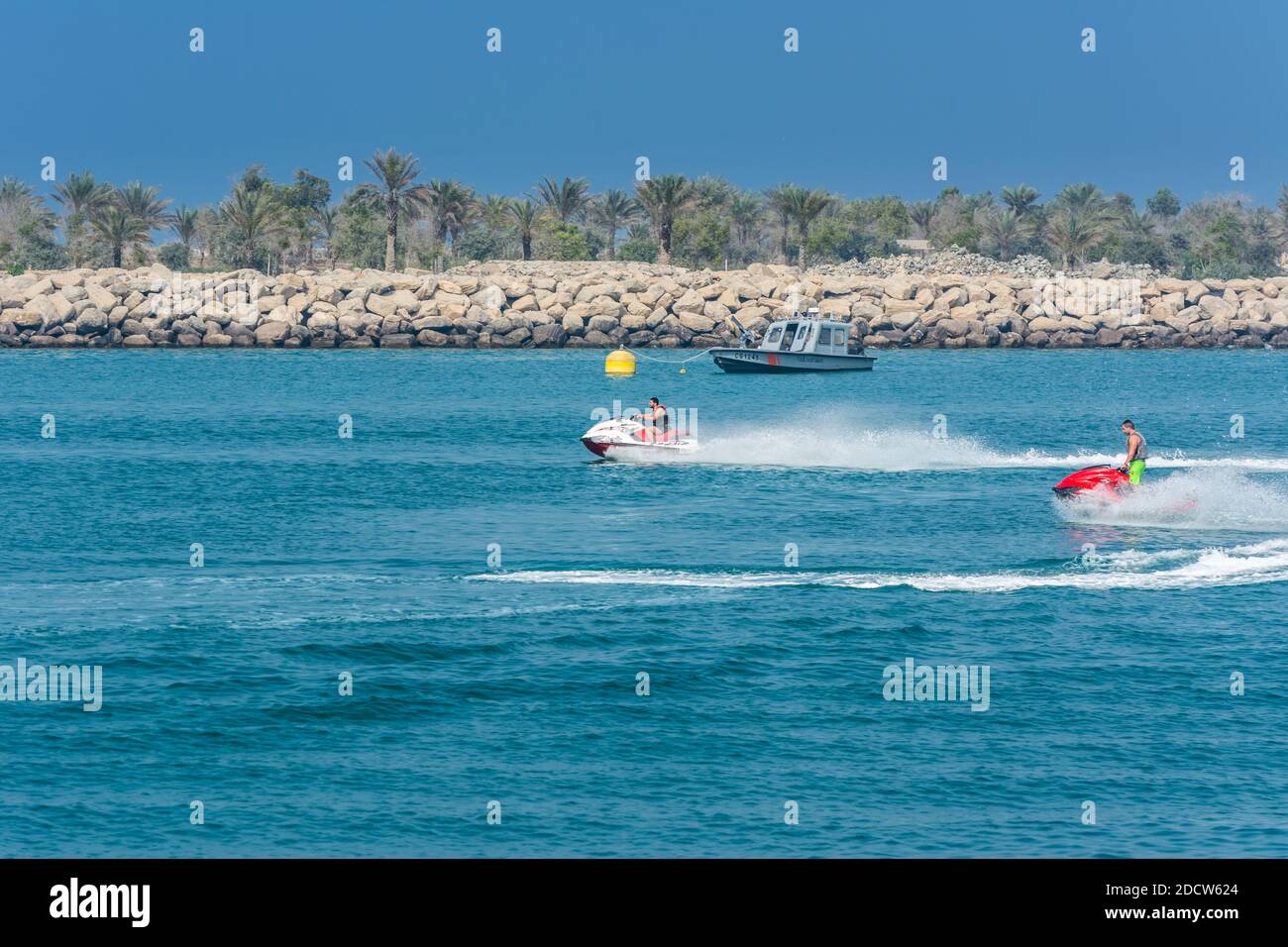 Tourist riding jet ski in the Persian bay in Abu Dhabi, United Arab ...