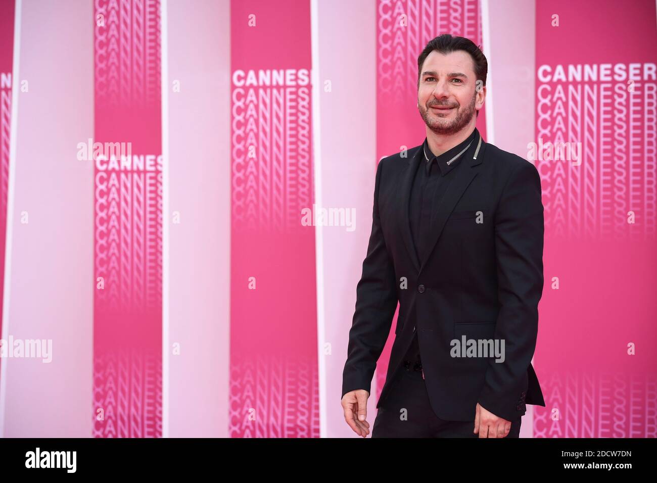 Michael Youn is posing along the pink carpet for the opening ...