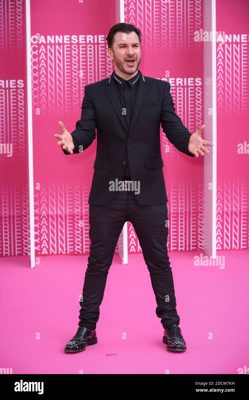 Michael Youn is posing along the pink carpet for the opening ...