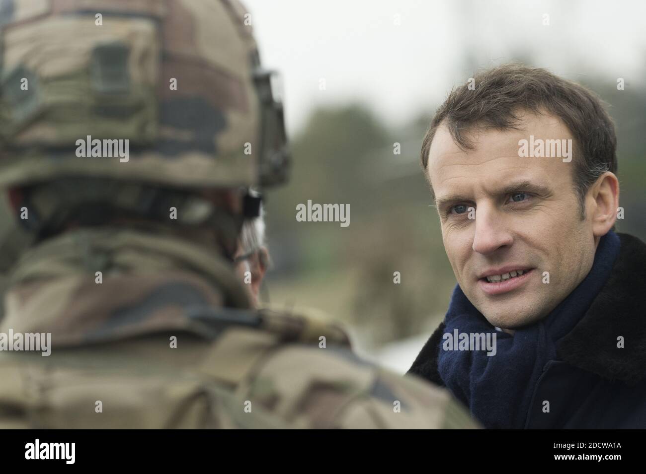 French President Emmanuel Macron (R) speaks with soldiers as he attends ...