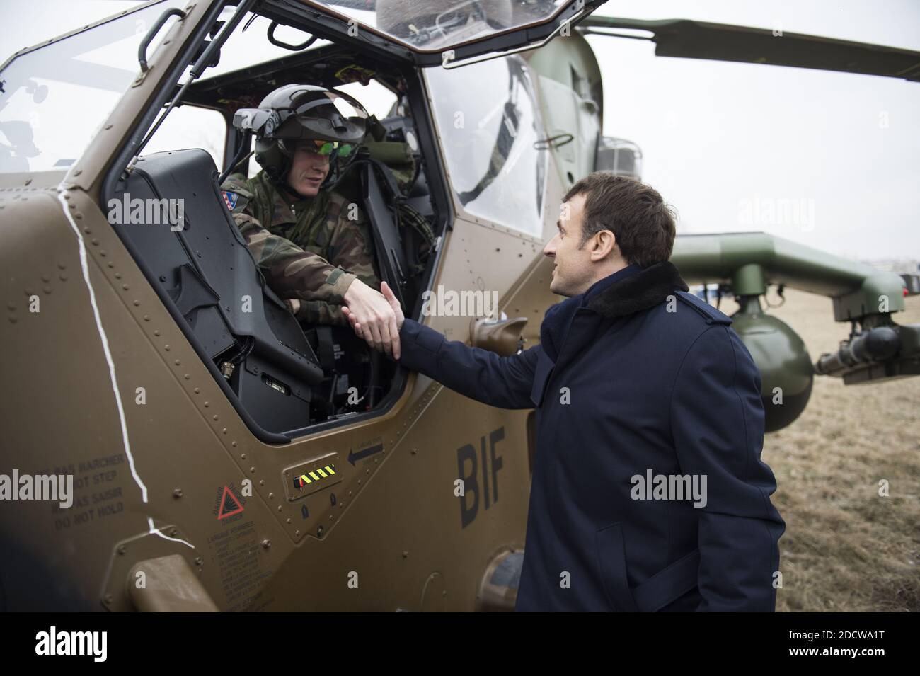 French President Emmanuel Macron (R) speaks with soldiers as he attends ...