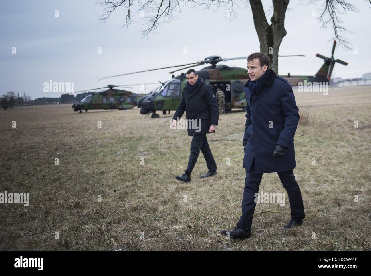 French President Emmanuel Macron walks after a flight aboard a NH90 ...