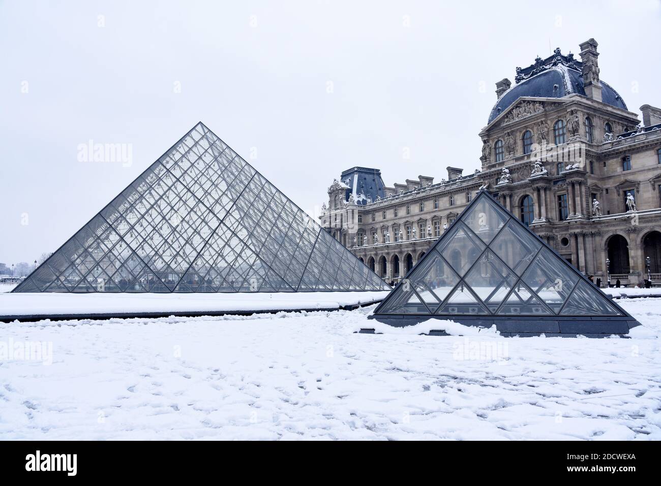 Louvre Museum Under The Snow in Paris, France on February 7, 2018 ...