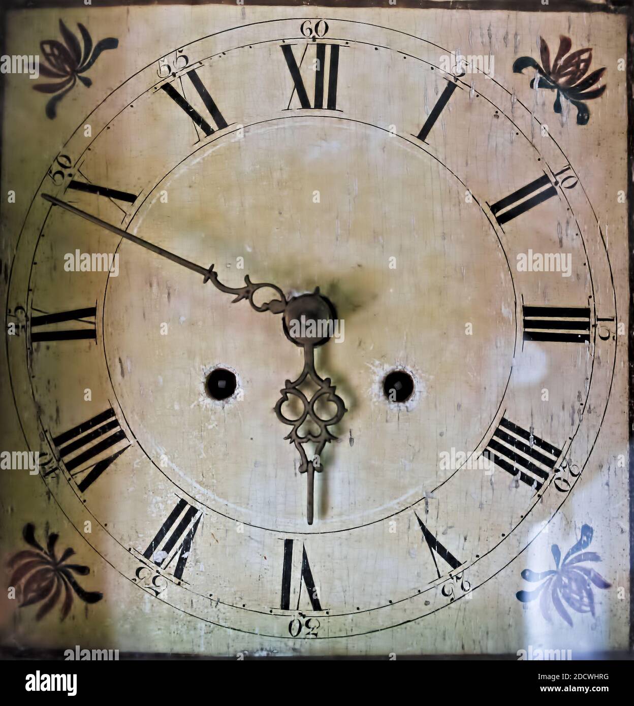 Old worn house clock with classic black numbers on cracked and ornate ...