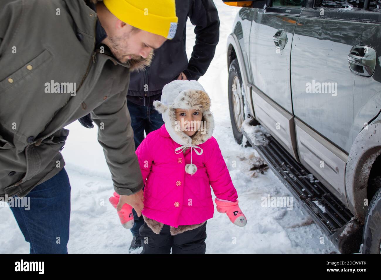 Father and concerned daughter smiling in a snowy forest Stock Photo - Alamy